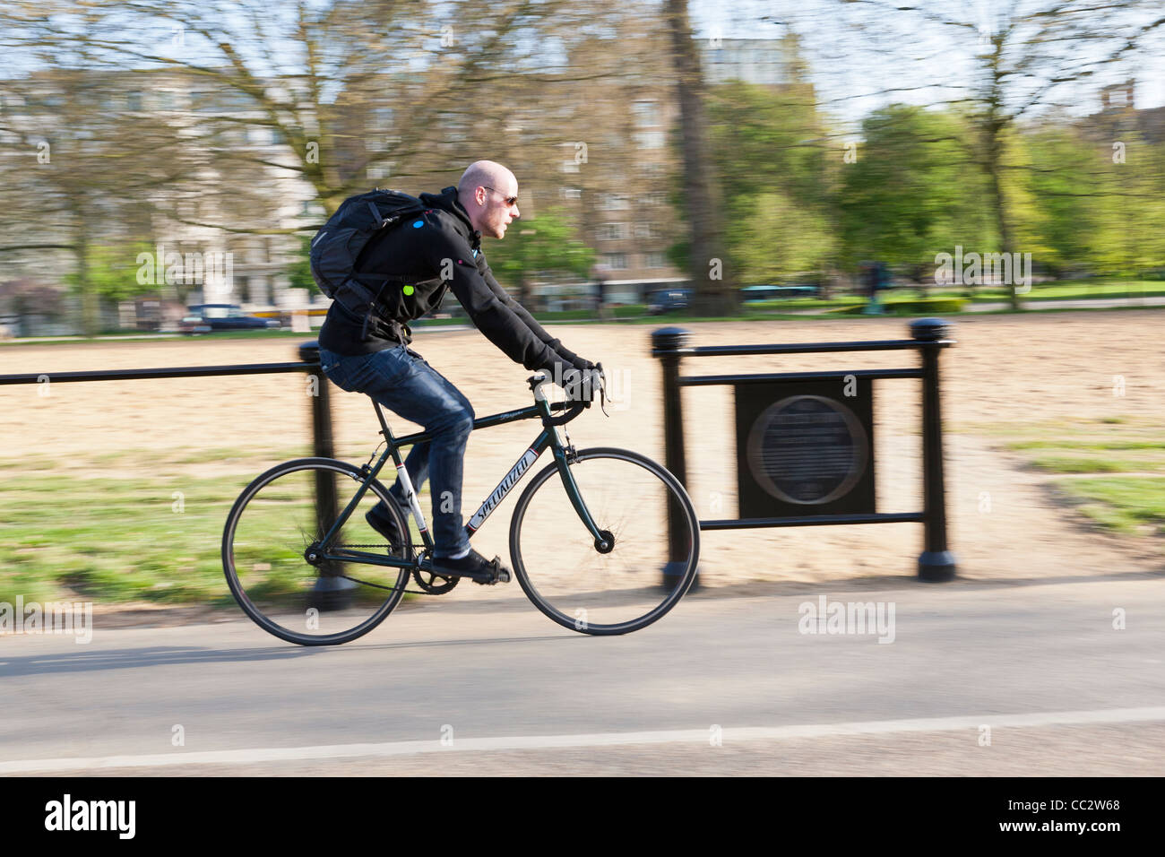 Man cycling along Rotten Row, Hyde Park, London Stock Photo - Alamy