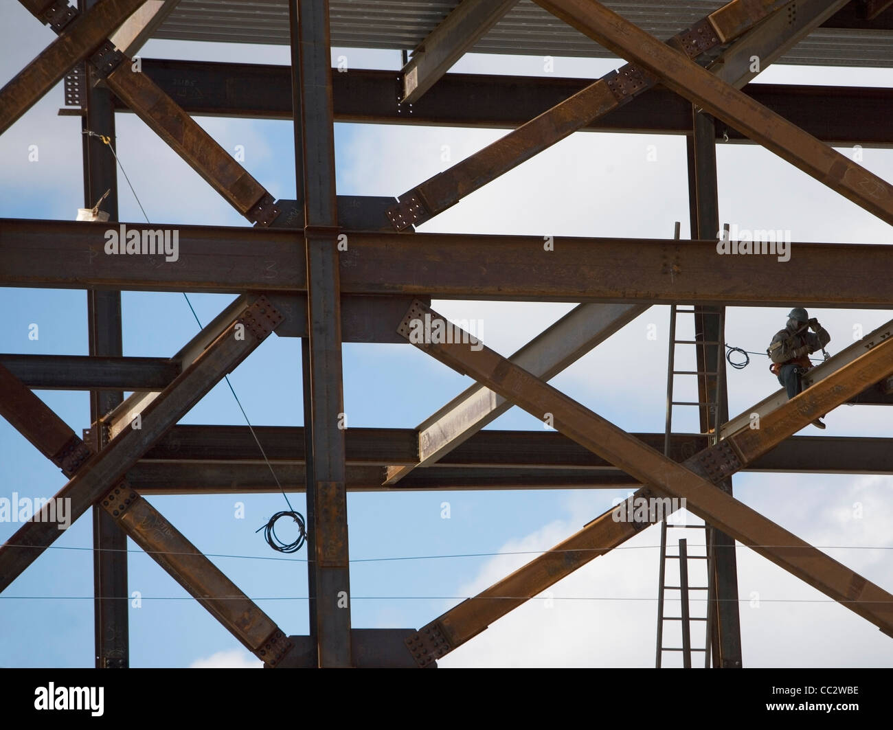 USA, New York City, Construction worker working on unfinished structure ...