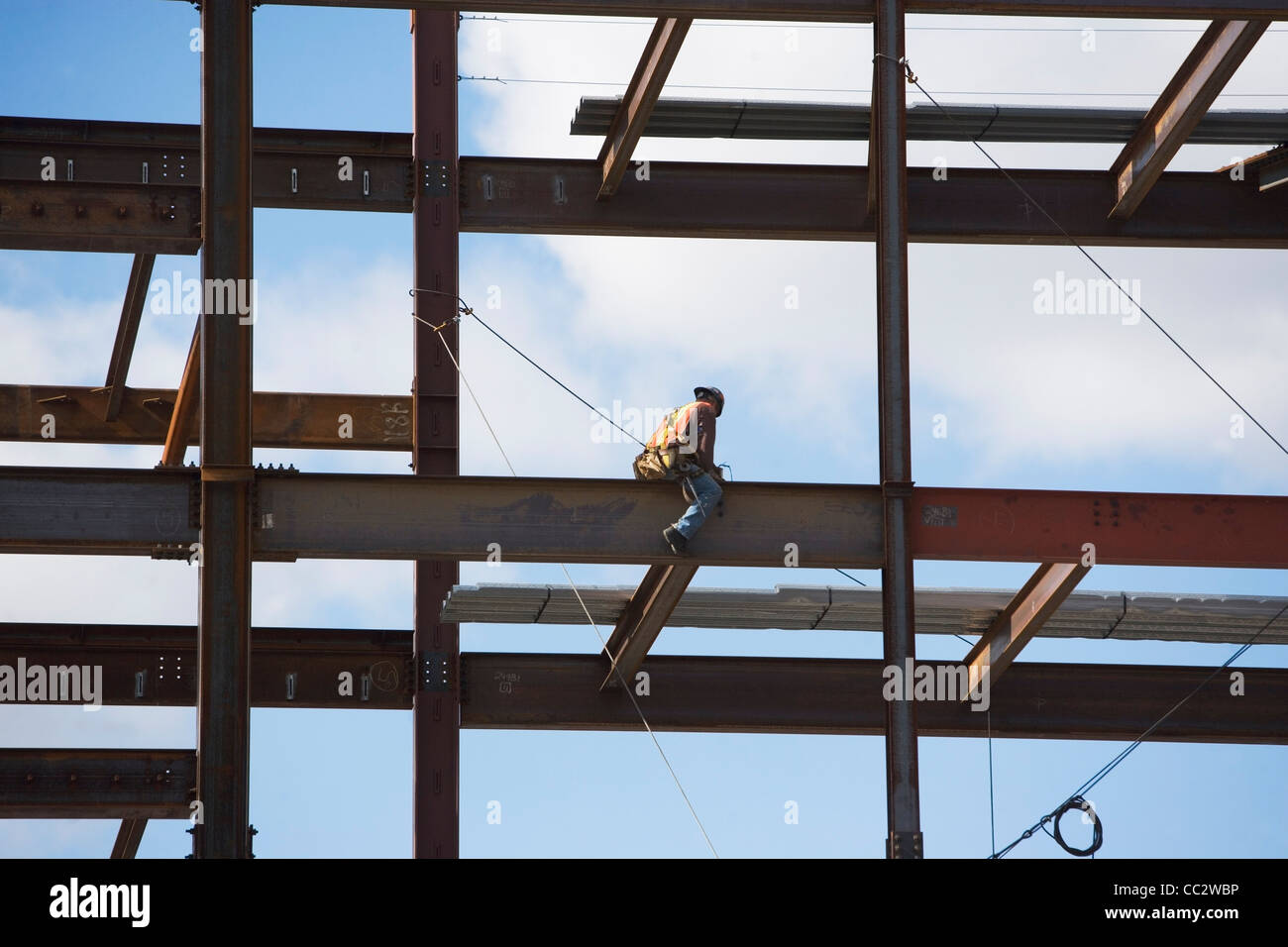 USA, New York City, Construction worker working on unfinished structure ...