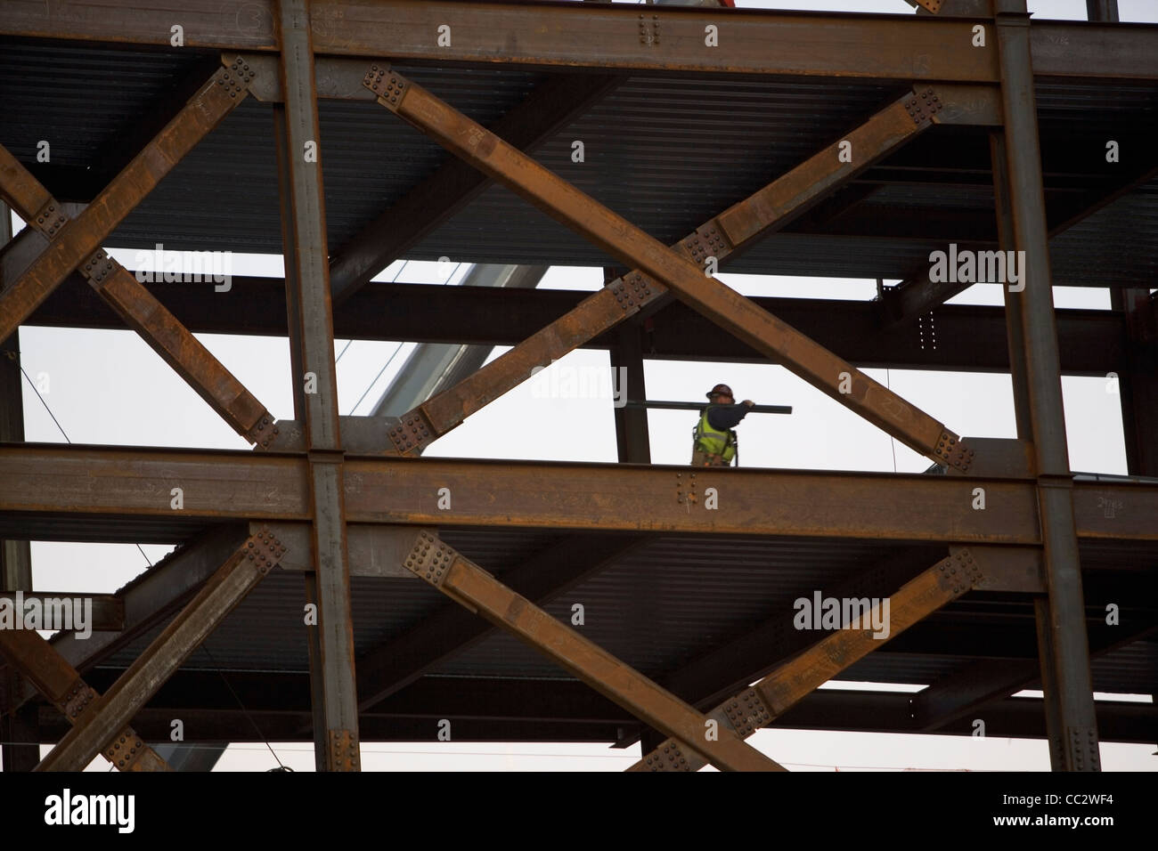 USA, New York City, Construction worker working on unfinished structure ...