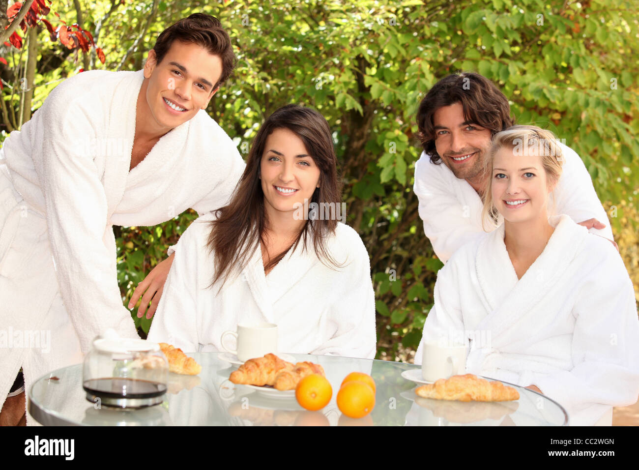Two couples sharing breakfast Stock Photo - Alamy
