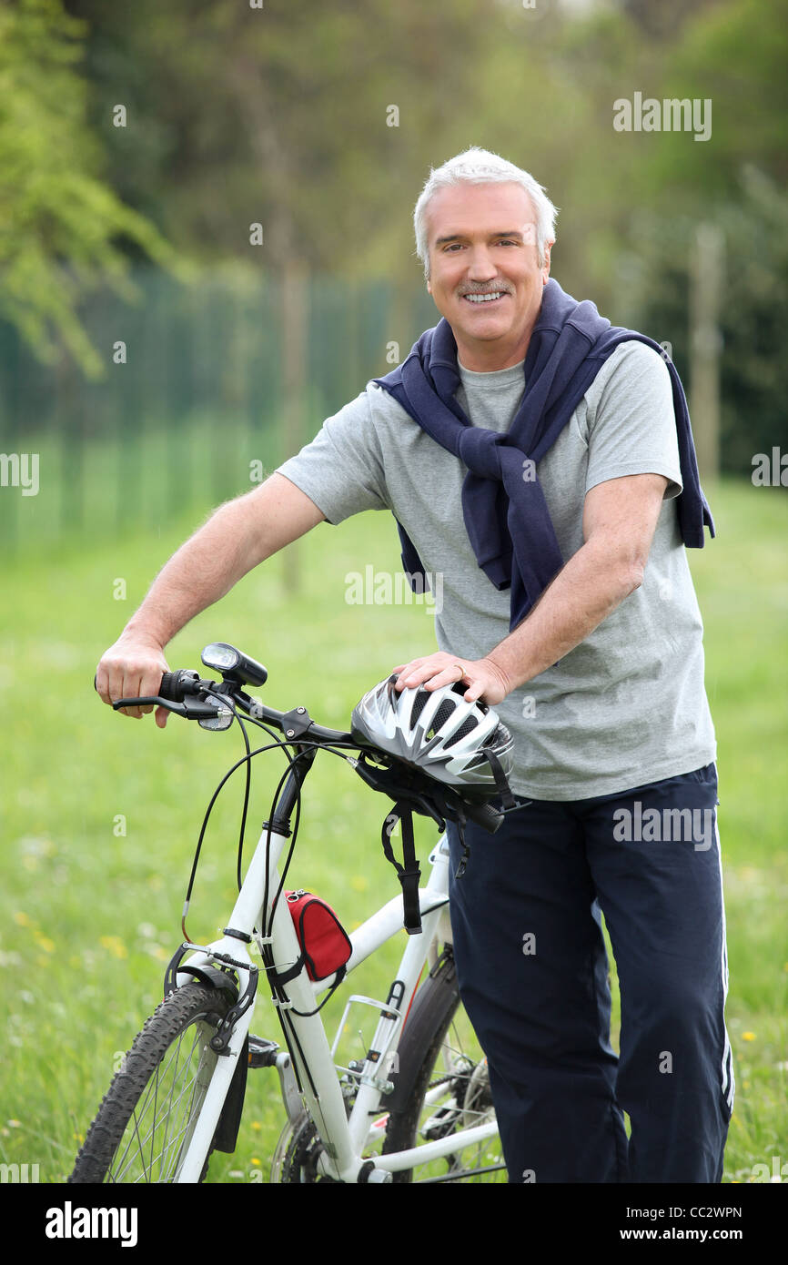 Man riding his bike Stock Photo - Alamy