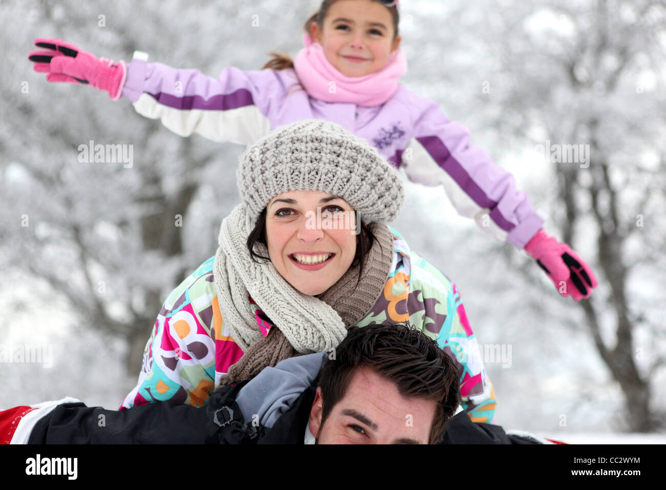 Family having fun outdoors on a cold winter's day Stock Photo - Alamy