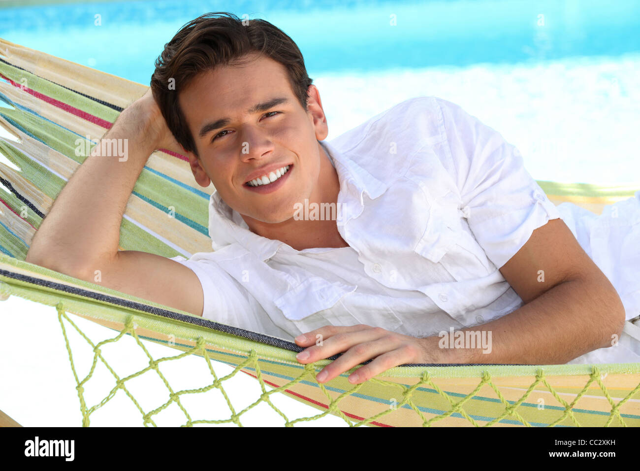 Man laying in hammock Stock Photo - Alamy