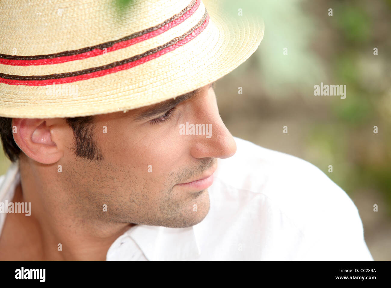 Man wearing a straw hat Stock Photo - Alamy