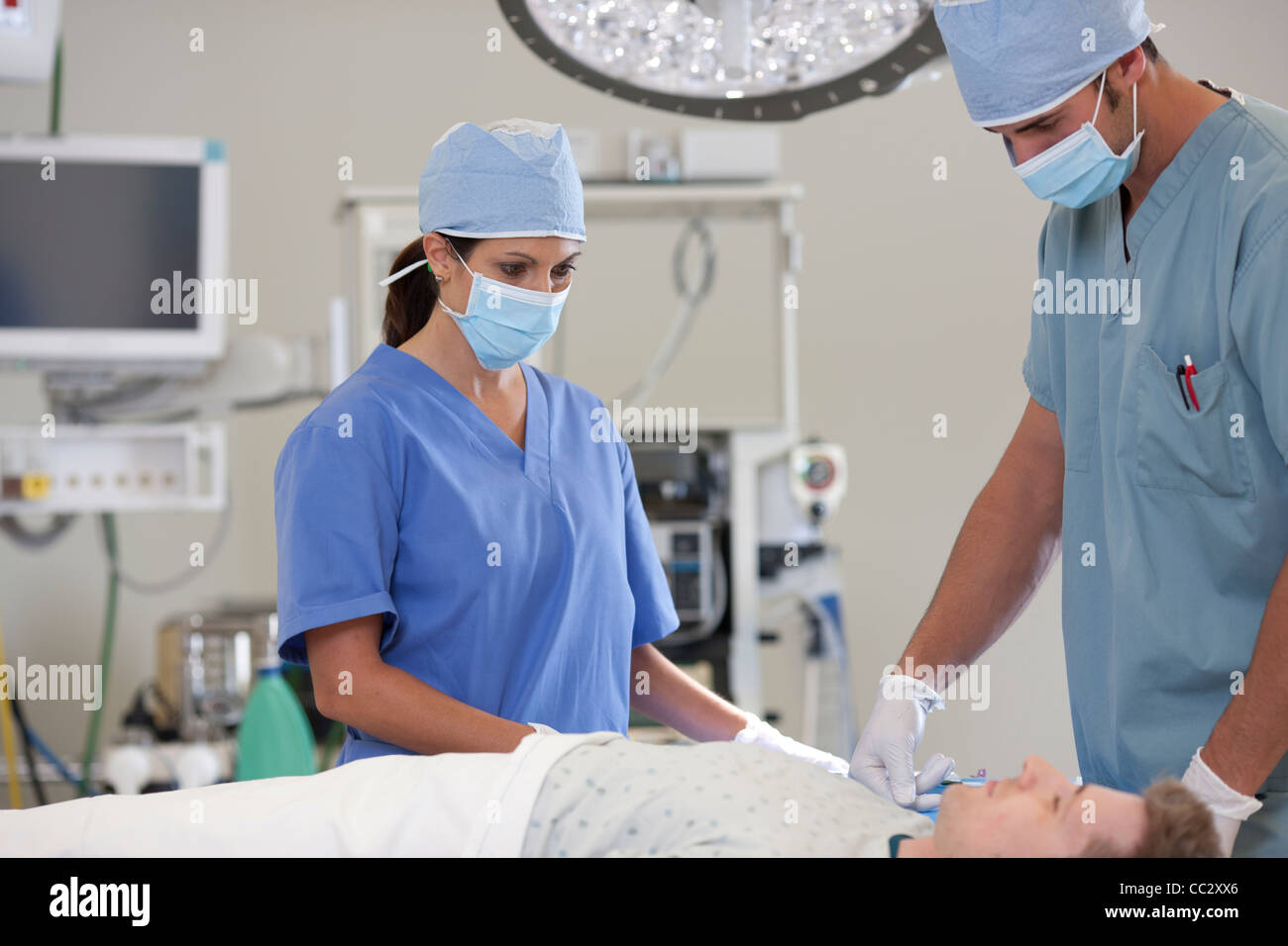 USA, Arizona, Phoenix, Surgeons preparing patient for surgery Stock ...