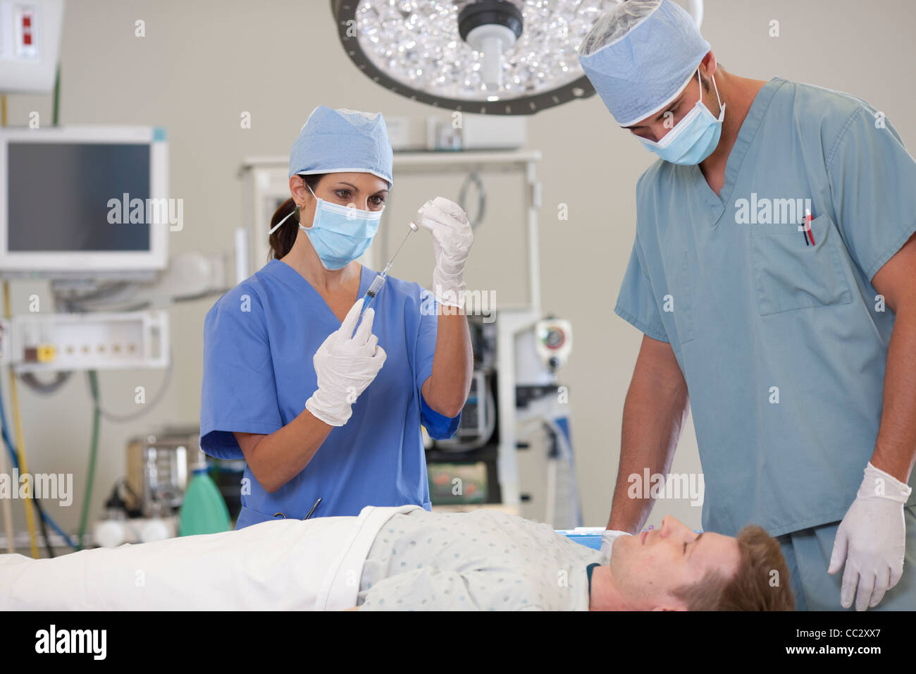 Doctor preparing iv patient hi-res stock photography and images - Alamy