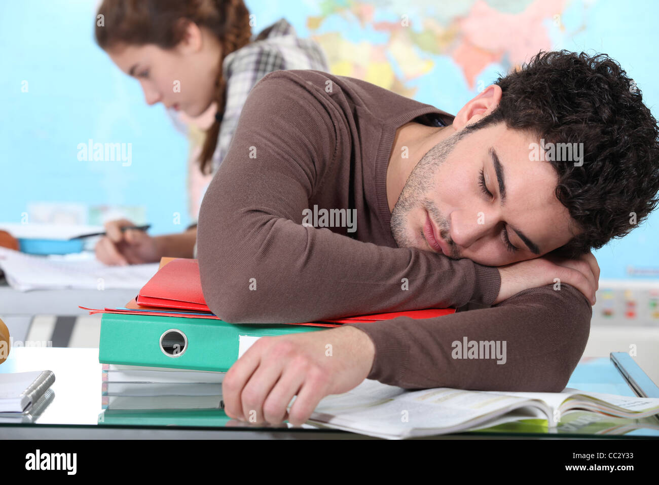 Young man sleeping during a university lecture Stock Photo - Alamy