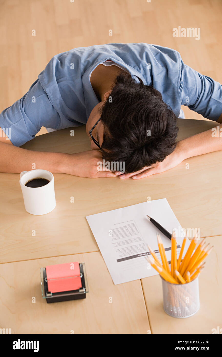 USA, California, Los Angeles, Businessman resting head on desk Stock ...