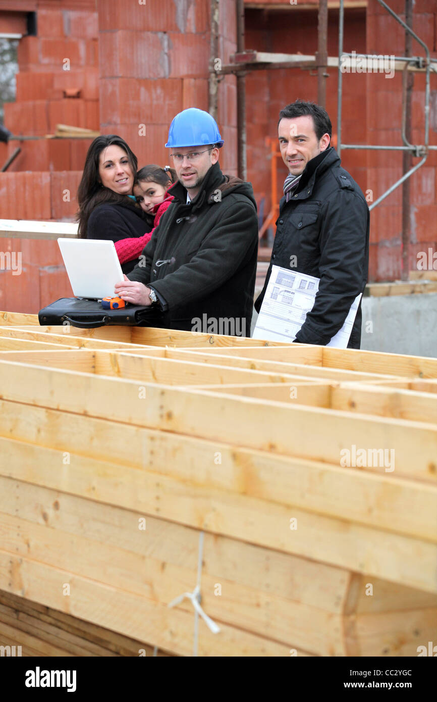 Architect with young family at construction site Stock Photo - Alamy