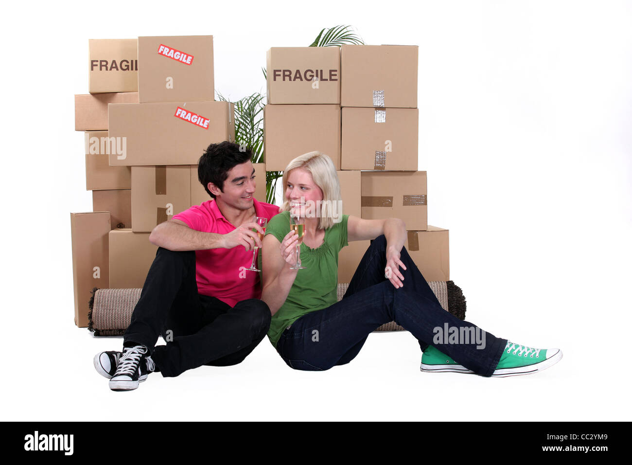 Moving house boxes couple Cut Out Stock Images & Pictures - Alamy