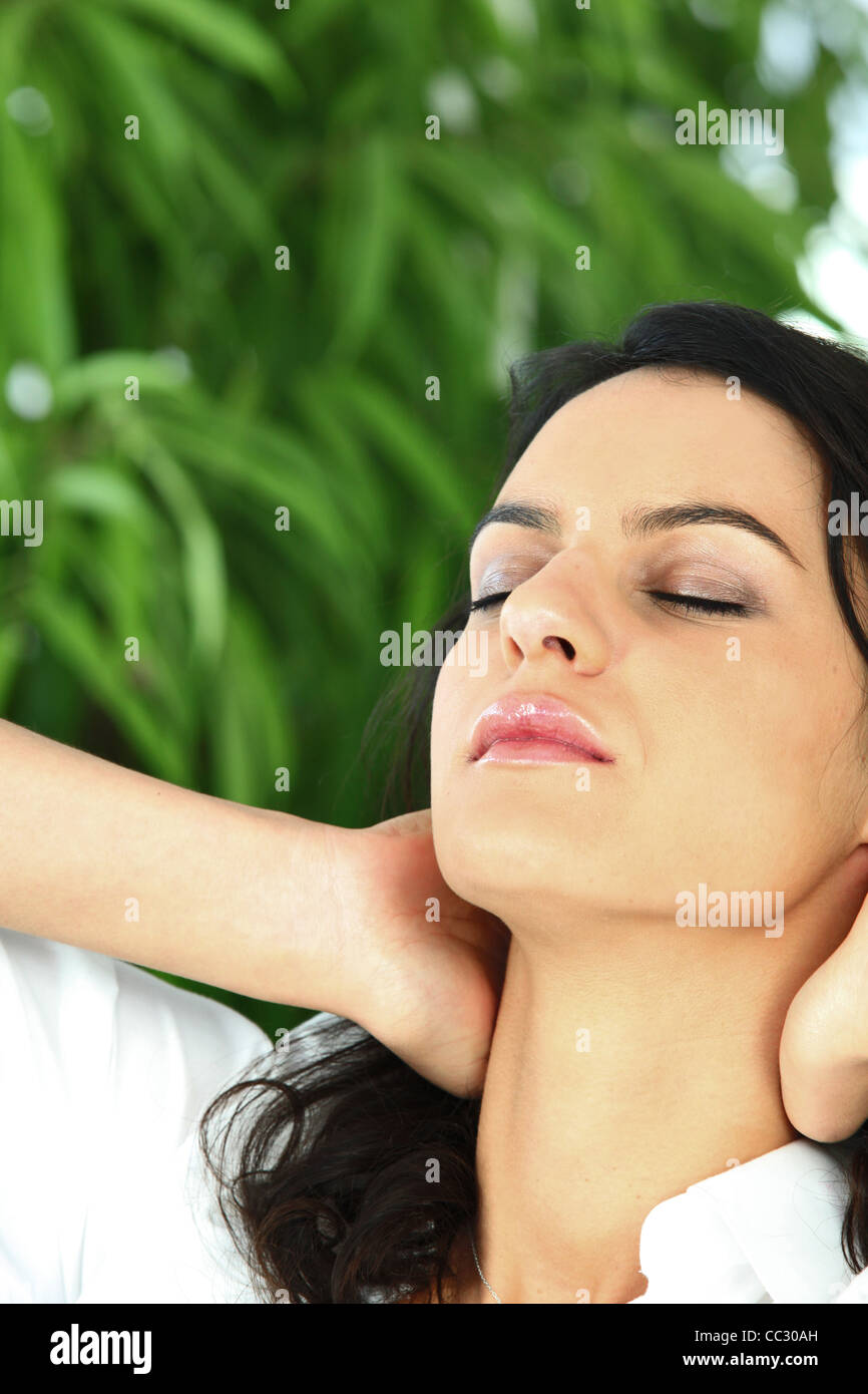 Tired woman stretching Stock Photo - Alamy
