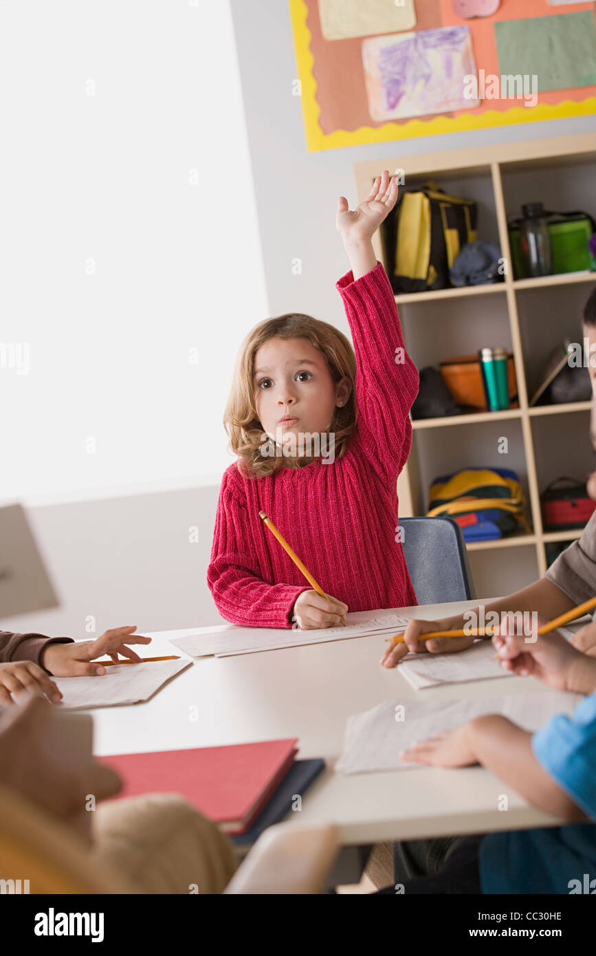 Girl rising hand school hi-res stock photography and images - Alamy