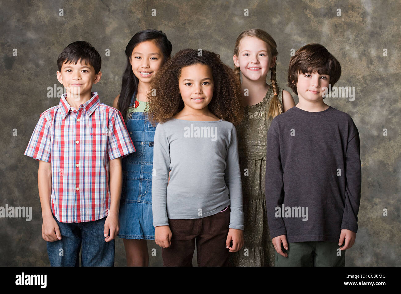 Children (6-7, 8-9) posing together, studio shot Stock Photo - Alamy