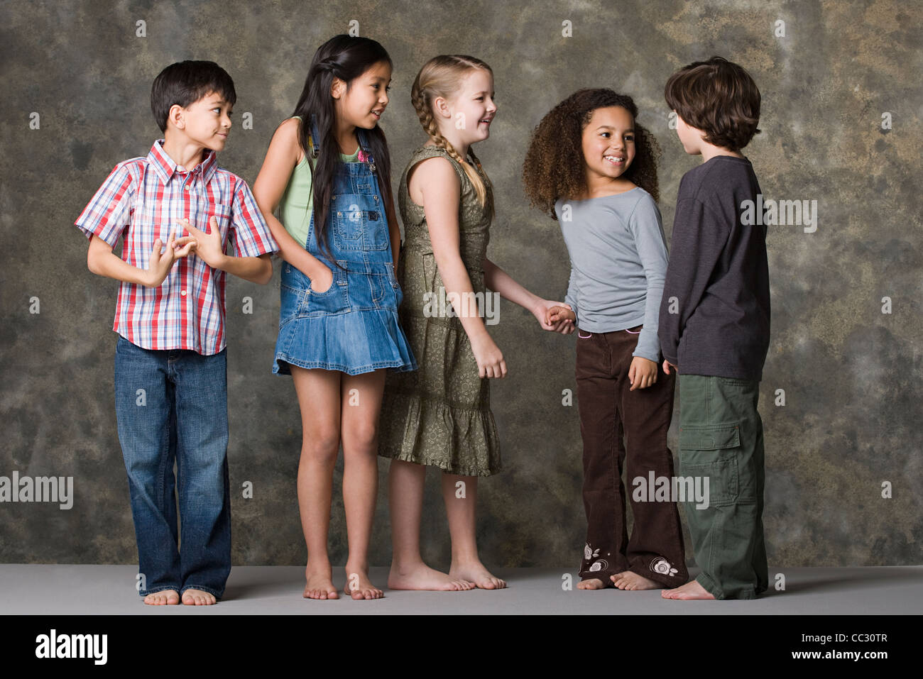 Children (6-7, 8-9) playing together, studio shot Stock Photo - Alamy