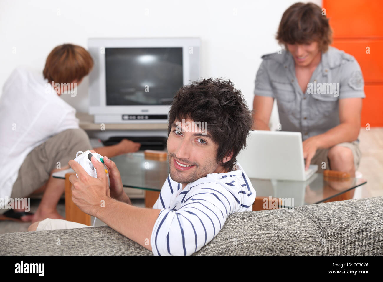 Guys playing computer games Stock Photo - Alamy