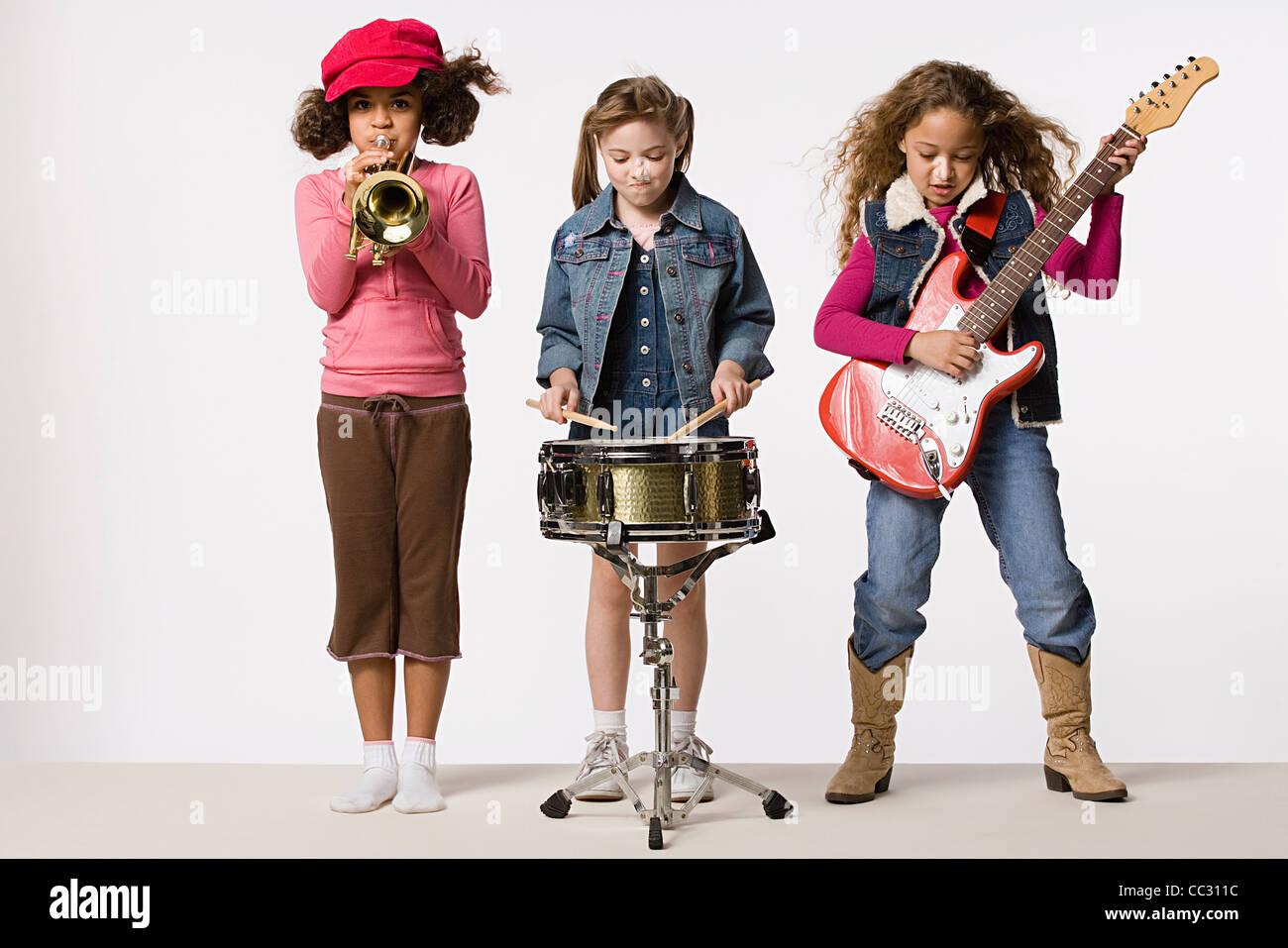Kids playing musical instruments hi-res stock photography and images ...