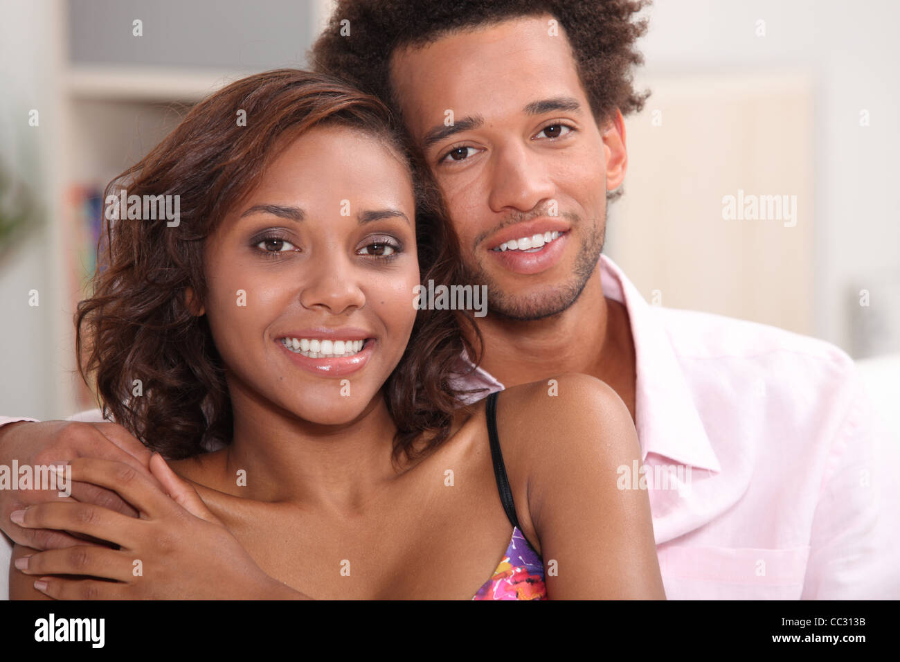 Young African couple at home Stock Photo - Alamy