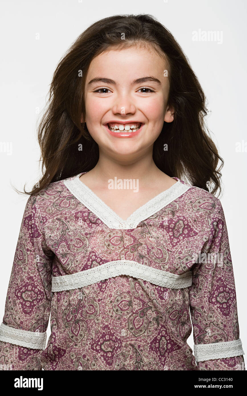 Studio portrait of smiling girl (8-9 Stock Photo - Alamy