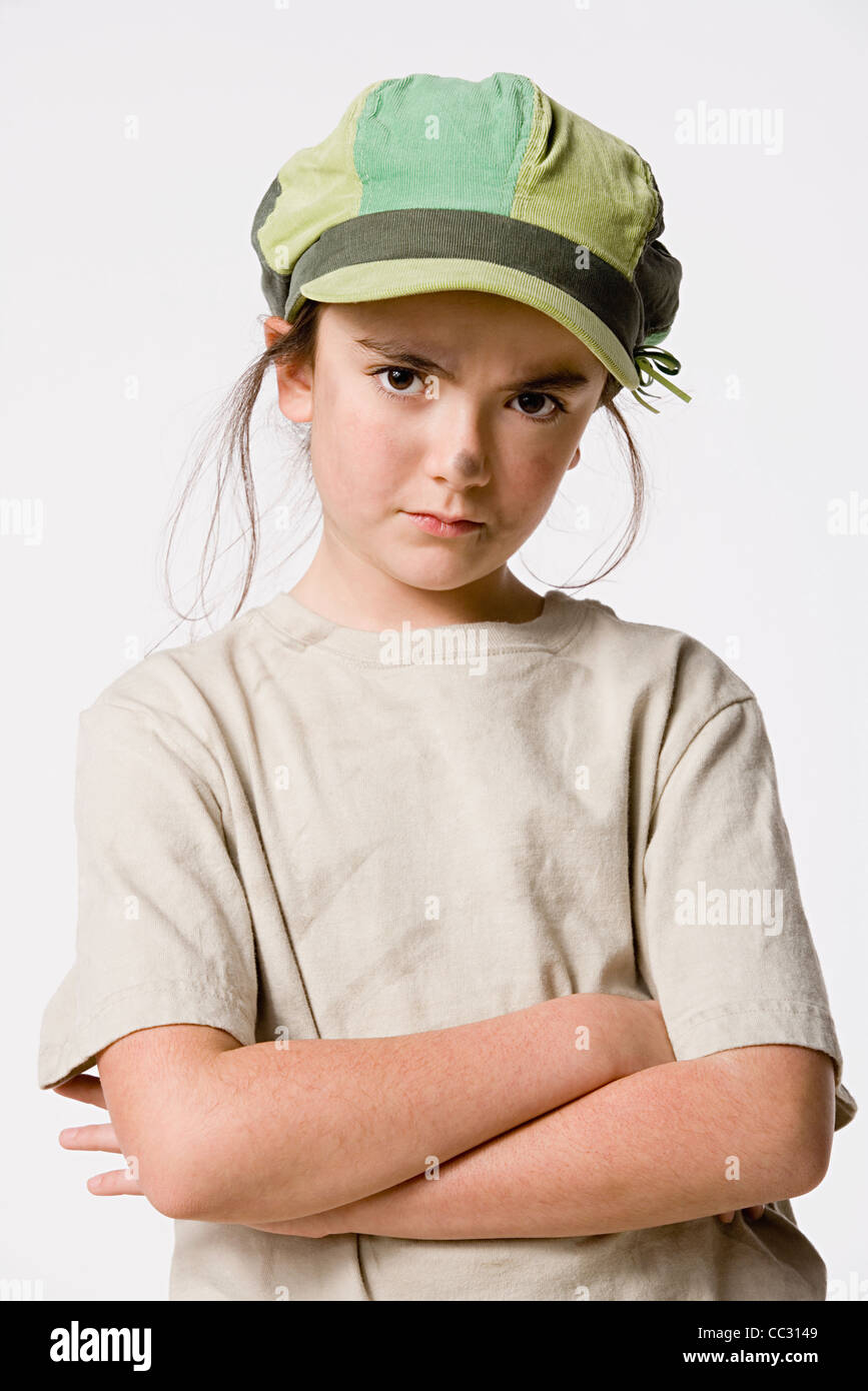 Studio portrait of sly girl (8-9 Stock Photo - Alamy