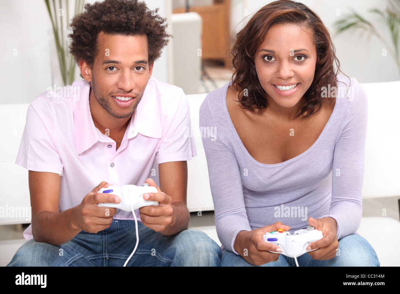 Couple playing computer games Stock Photo - Alamy