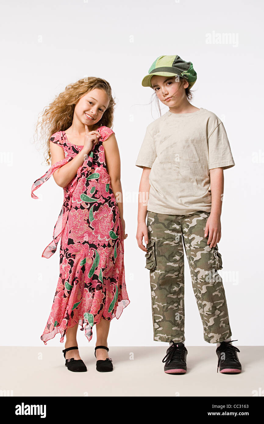 Studio portrait of two smiling girls (8-9 Stock Photo - Alamy