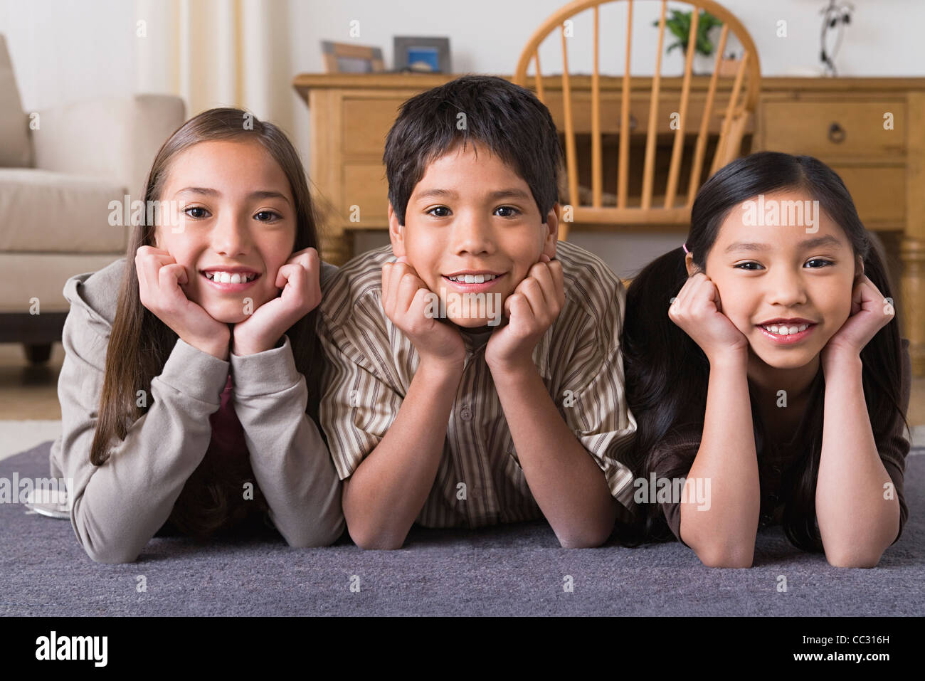 USA, California, Los Angeles, Portrait of smiling siblings (8-9, 10-11 ...