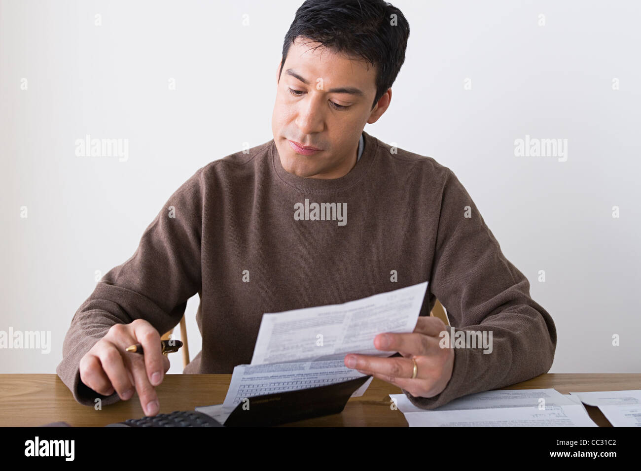 USA, California, Los Angeles, Man doing paperwork Stock Photo - Alamy