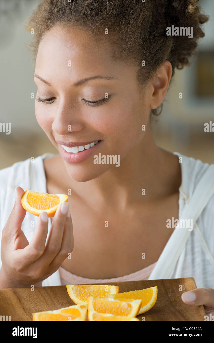 USA, California, Los Angeles, Portrait of attractive woman eating ...
