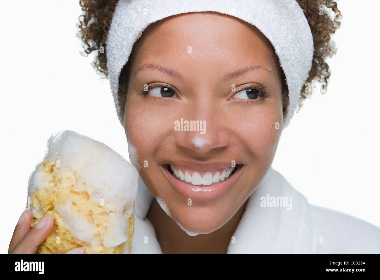 Portrait of attractive woman holding bath sponge Stock Photo - Alamy