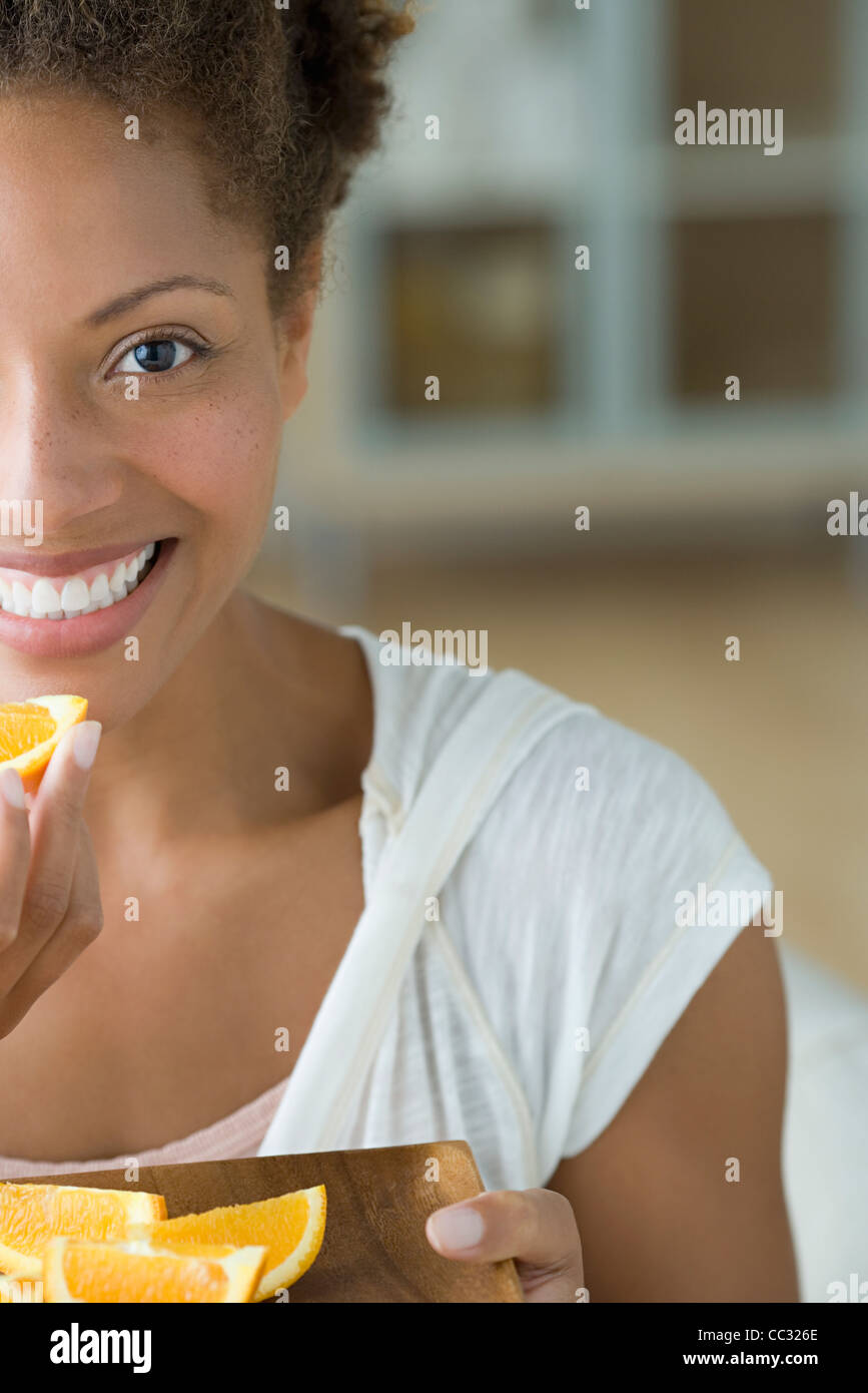 USA, California, Los Angeles,, Attractive woman eating orange Stock ...