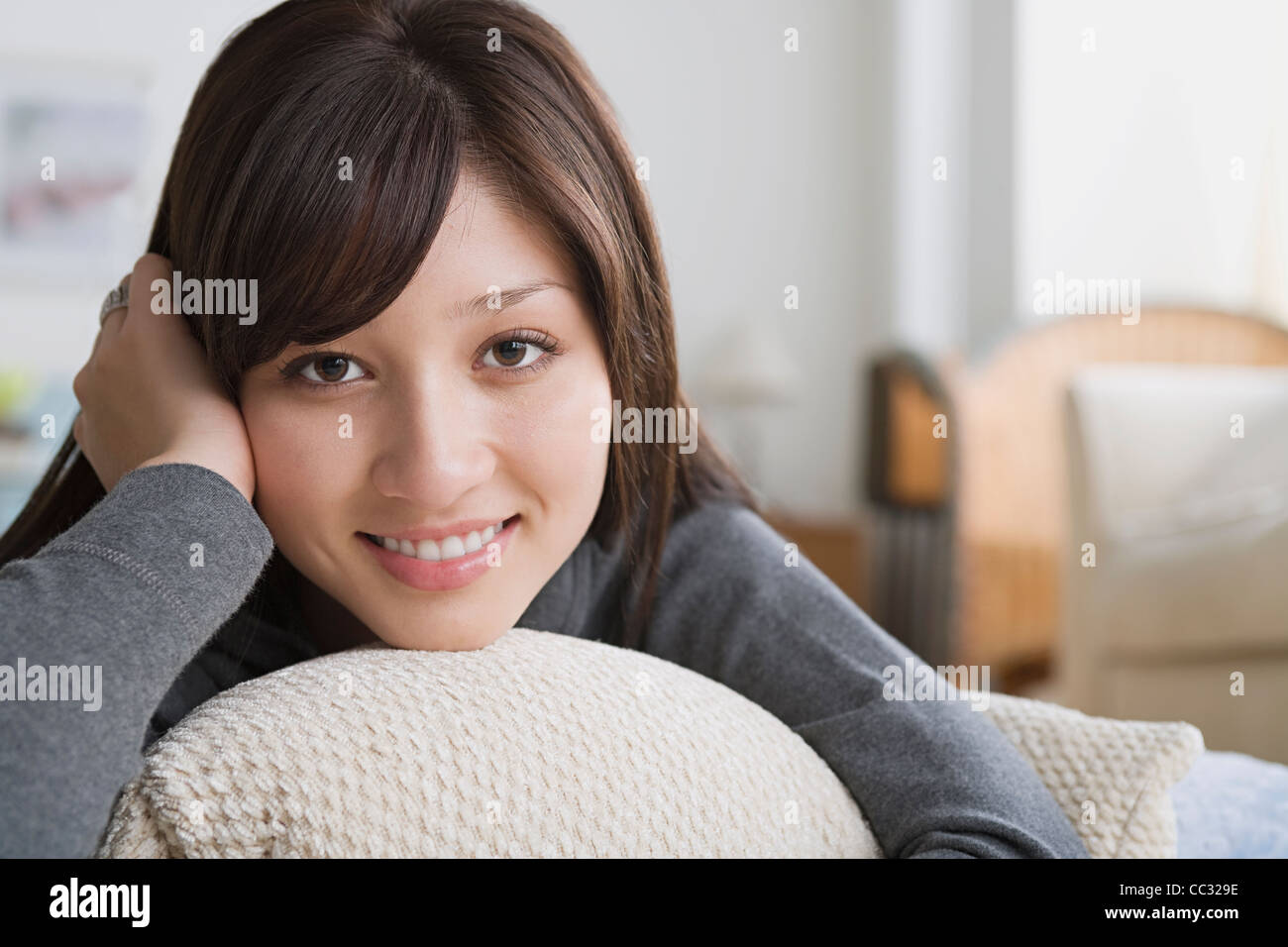USA, California, Los Angeles, Young woman relaxing on sofa Stock Photo ...