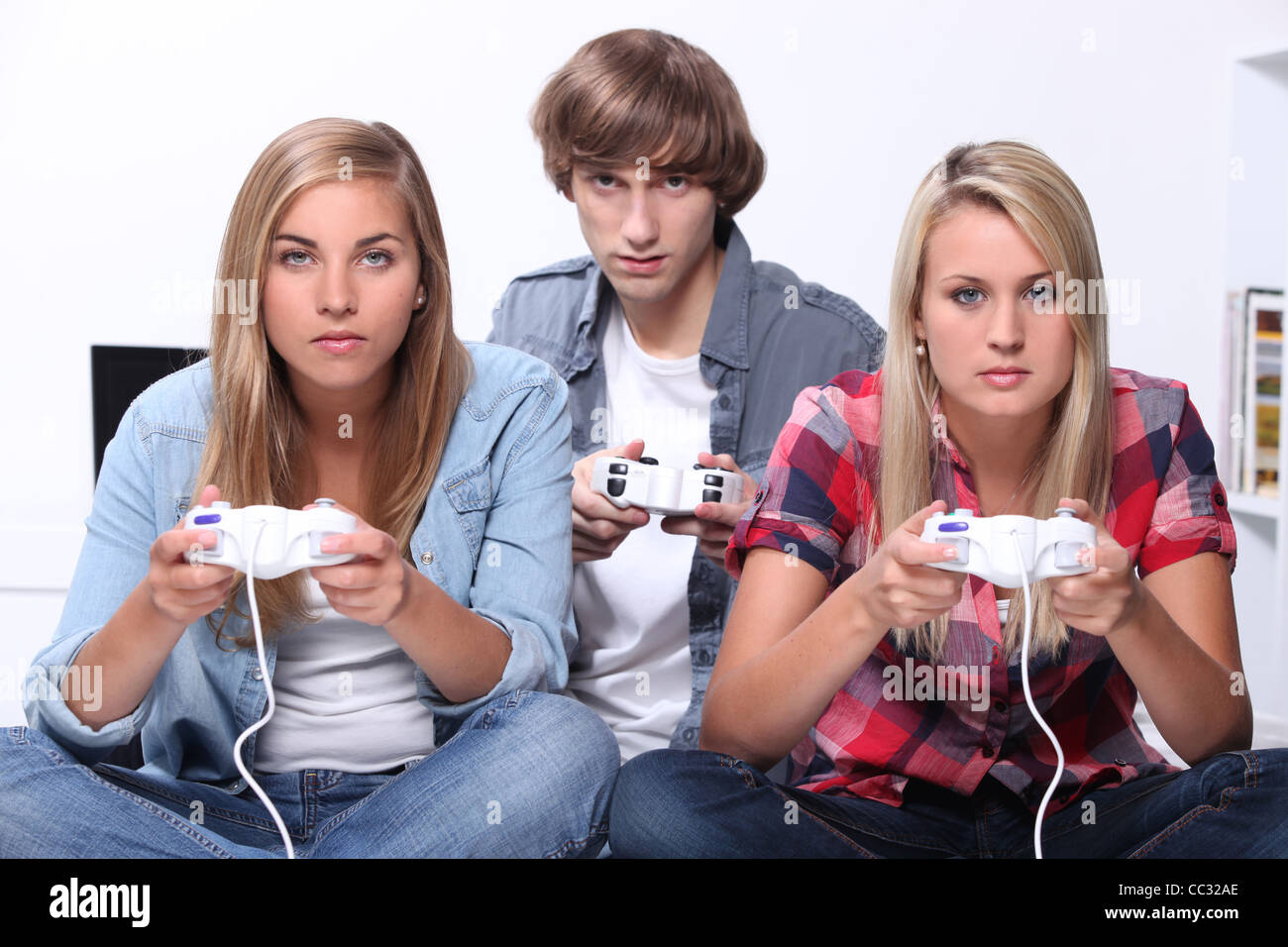 teenagers playing video games Stock Photo - Alamy