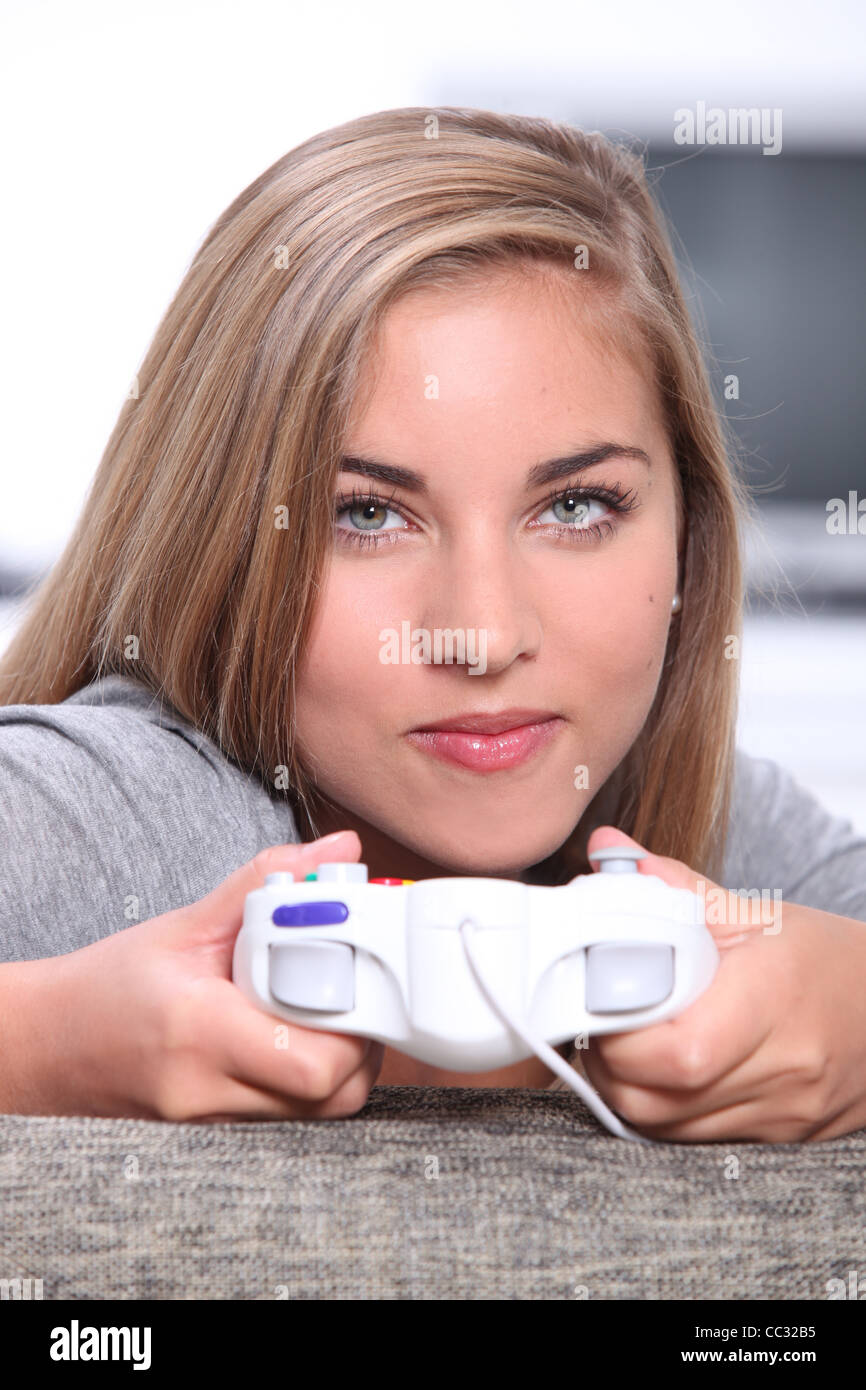 Teenage girl playing on games console Stock Photo - Alamy