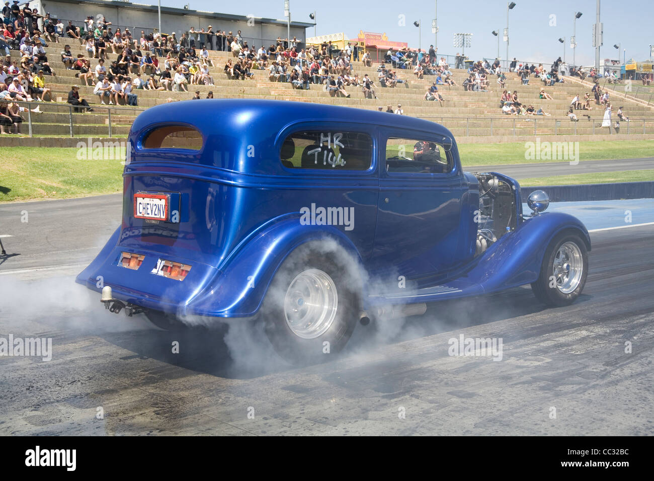 Hot rod hotrod performing a tire smoking burnout prior to drag racing ...