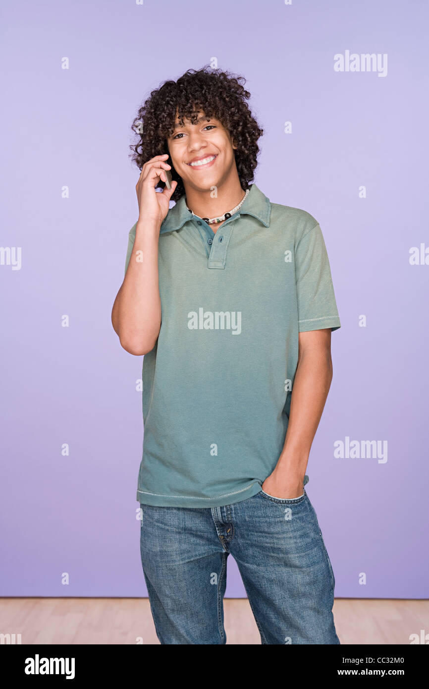 Portrait of teenage boy (14-15) talking on mobile phone Stock Photo - Alamy