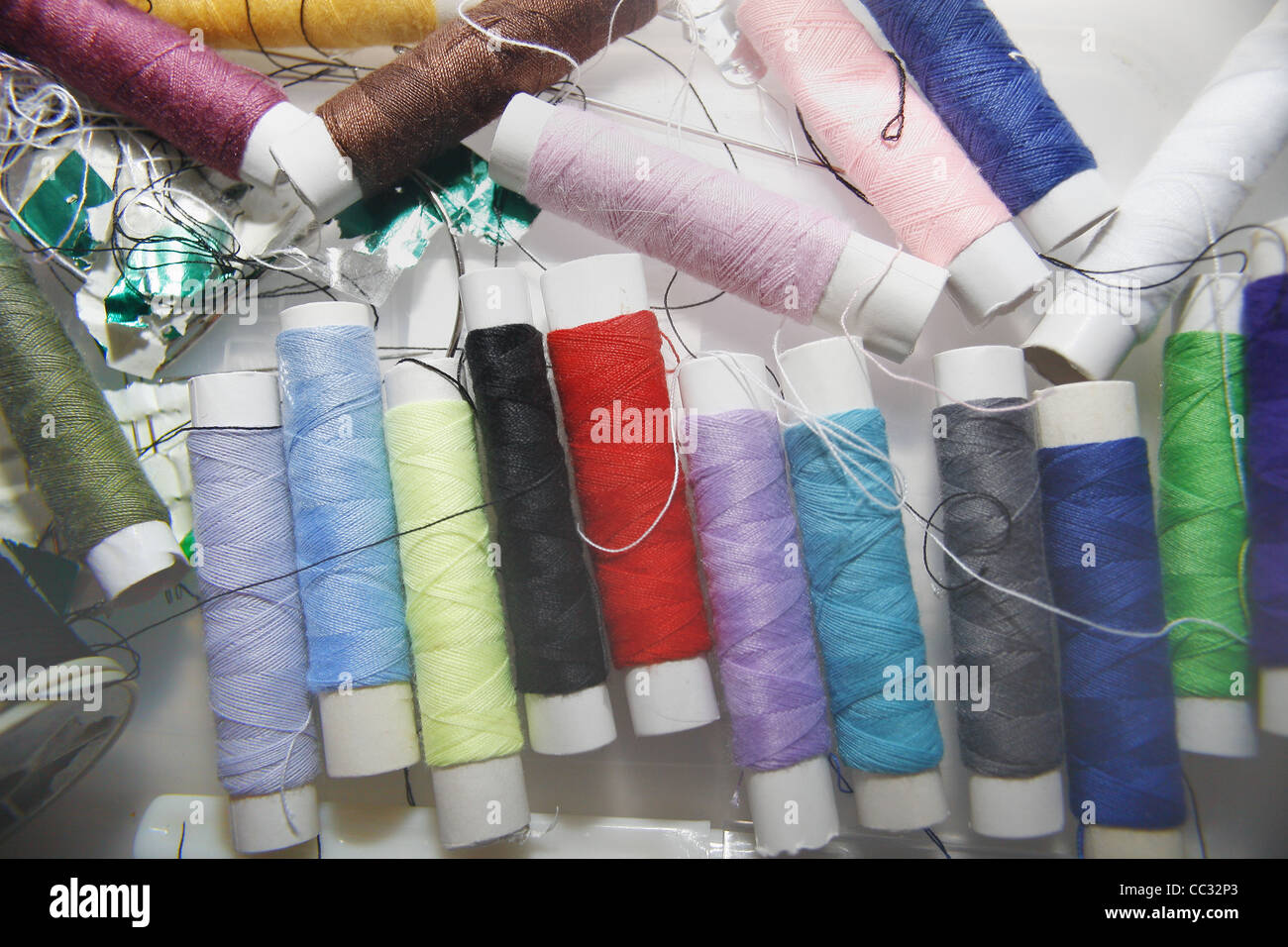 Red and white coloured threads hi-res stock photography and images - Alamy