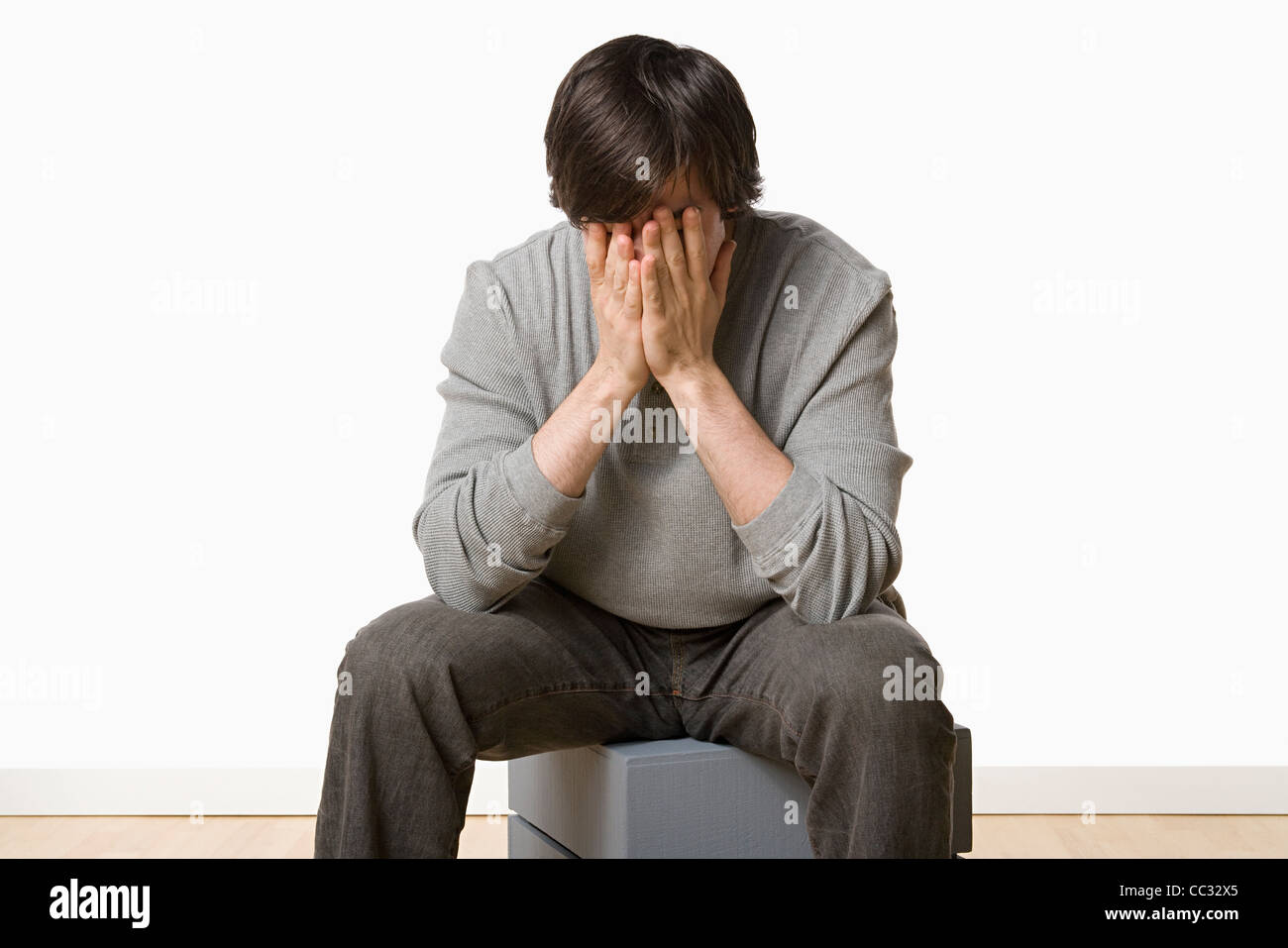 Studio portrait of young man crying Stock Photo - Alamy