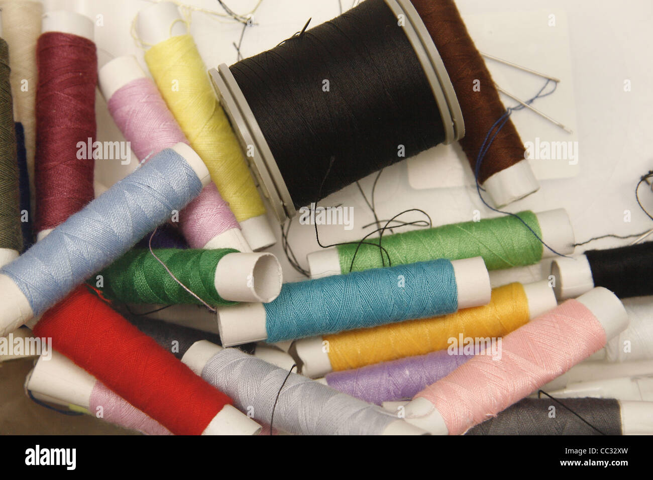 image of multi coloured cotton reels and threads Stock Photo - Alamy