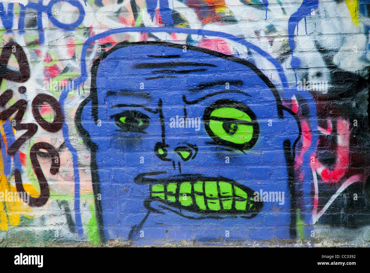 The man with blue face and green teeth and eyes Stock Photo - Alamy