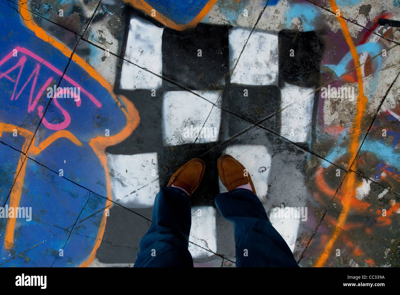 Standing on a graffiti chessboard Stock Photo - Alamy