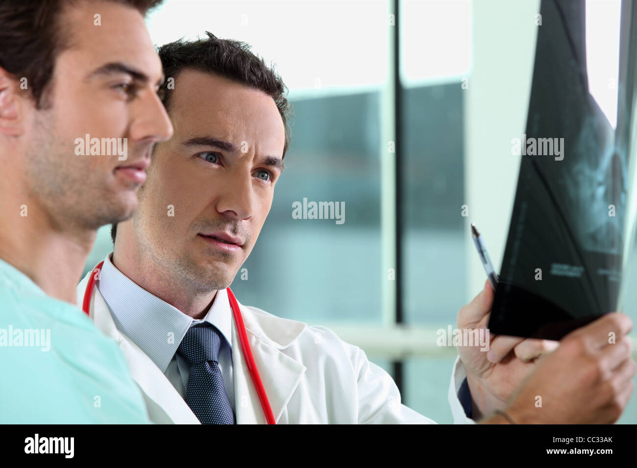 doctor and assistant with x-ray Stock Photo - Alamy