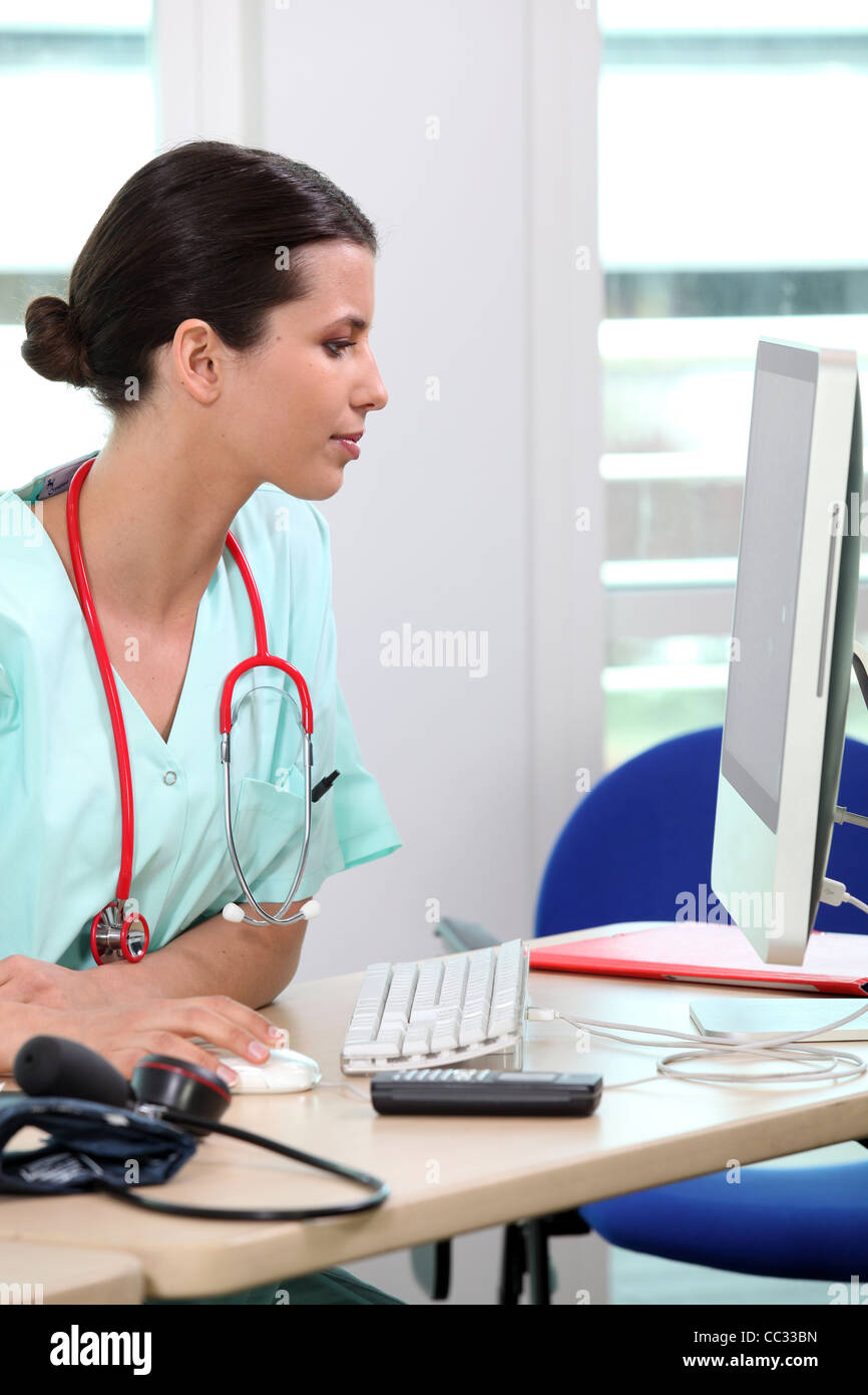 Nurse using a computer Stock Photo - Alamy
