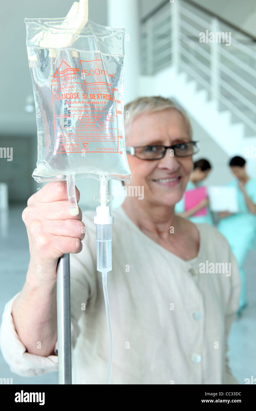 Elderly woman with a hospital drip Stock Photo - Alamy