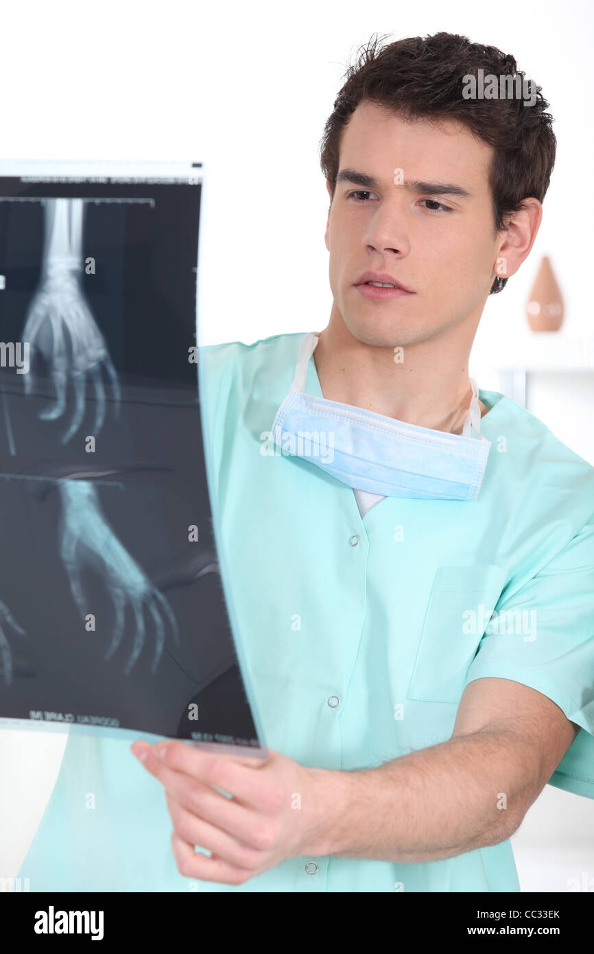 Doctor looking at an x-ray Stock Photo - Alamy