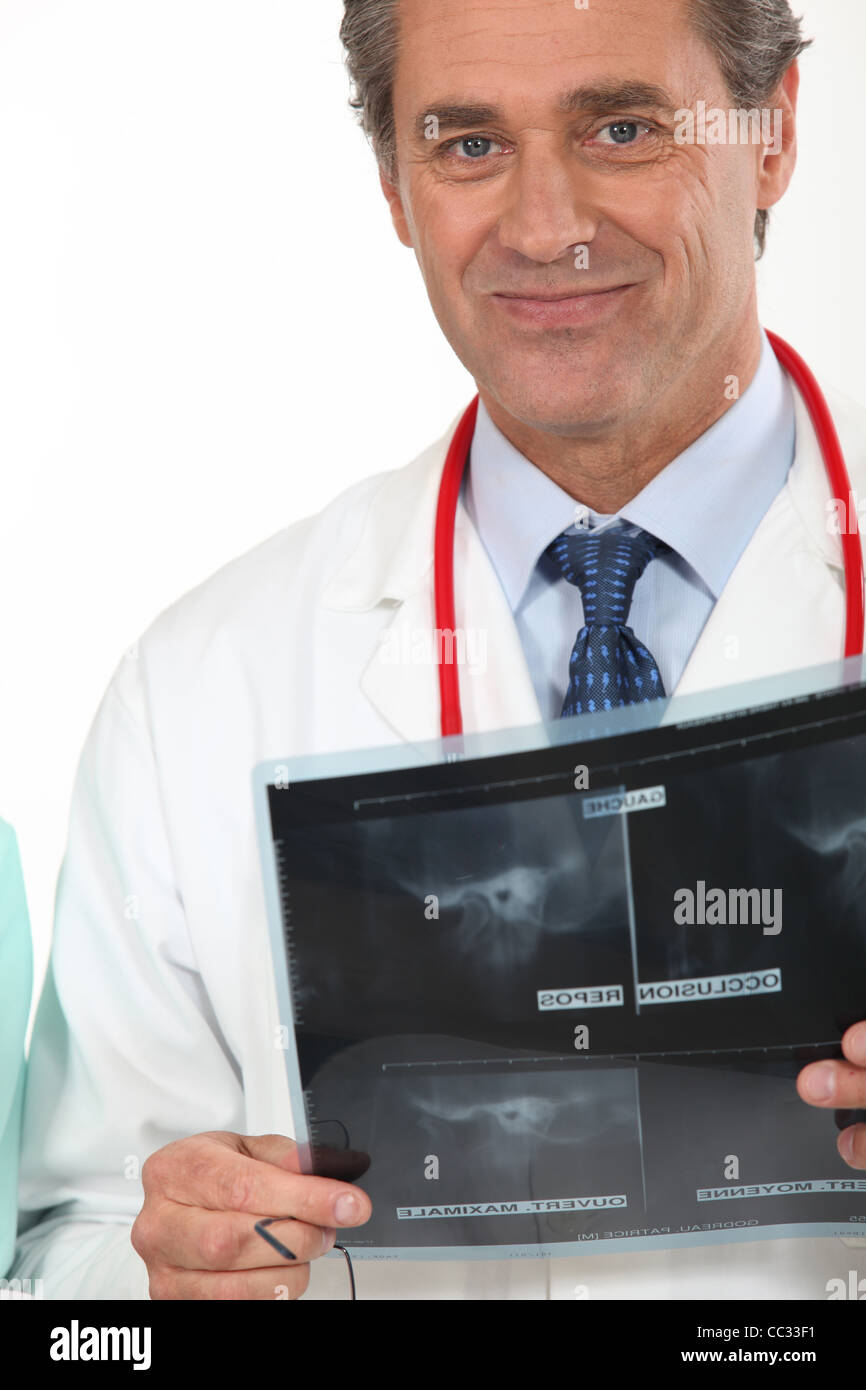 Doctor holding x-ray image Stock Photo - Alamy