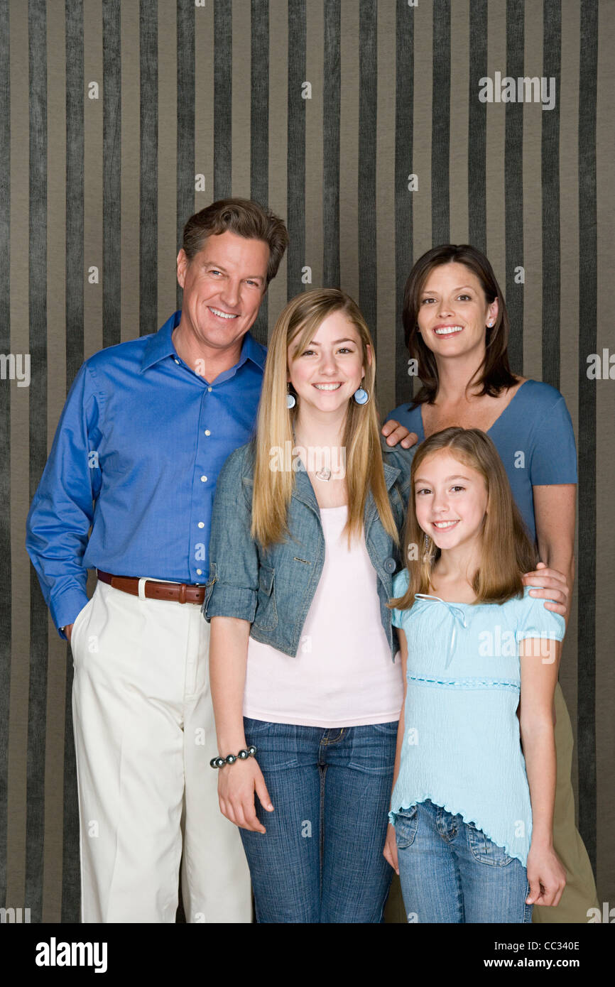 Portrait of two generation family with two daughters (8-9, 14-15 Stock ...