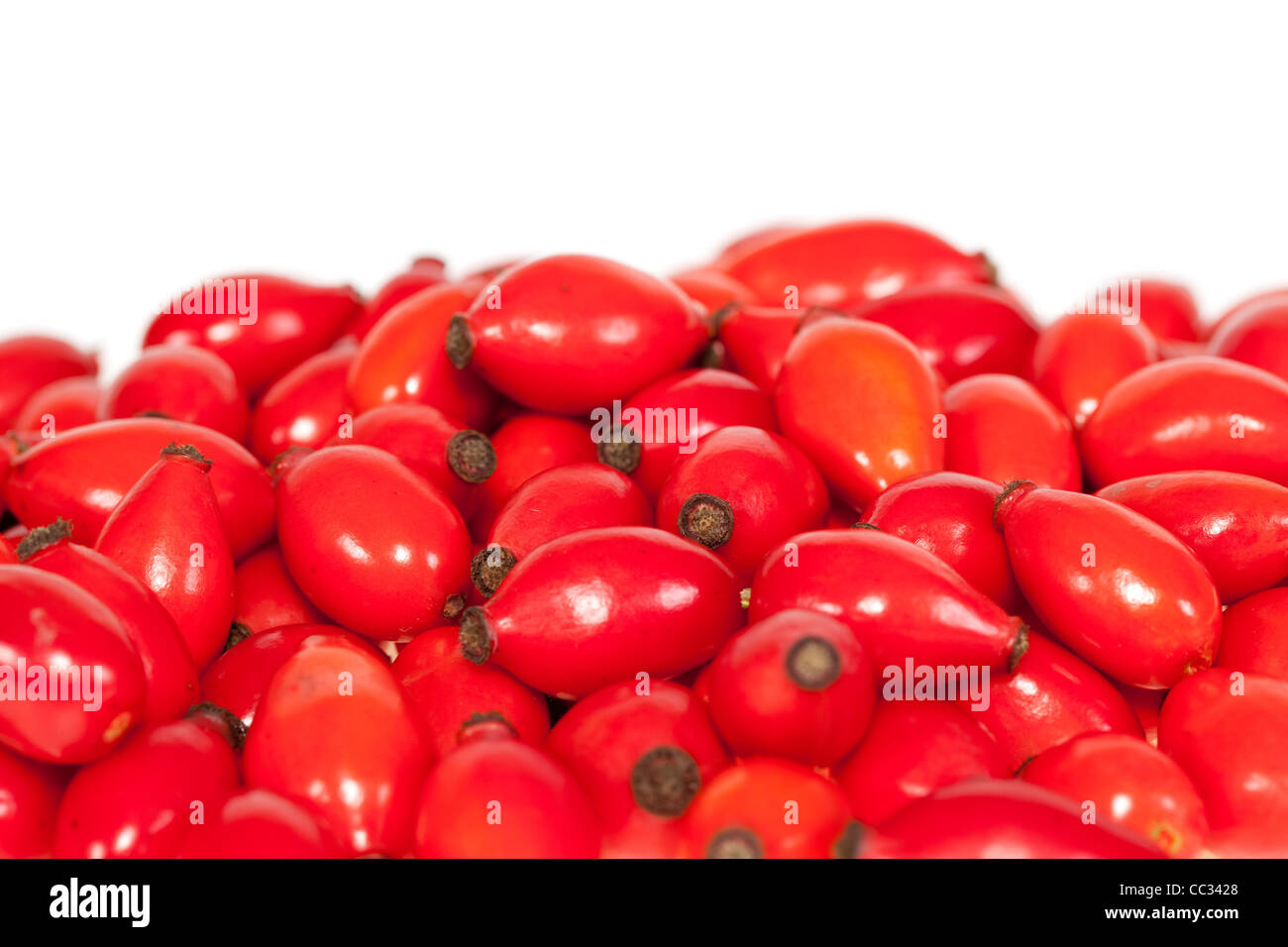 whole red fruit rose on white background Stock Photo - Alamy