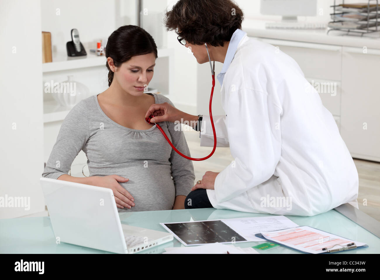 Pregnant woman at a doctor's surgery Stock Photo - Alamy