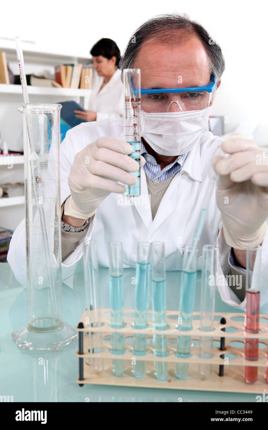 Chemist making experiments Stock Photo - Alamy